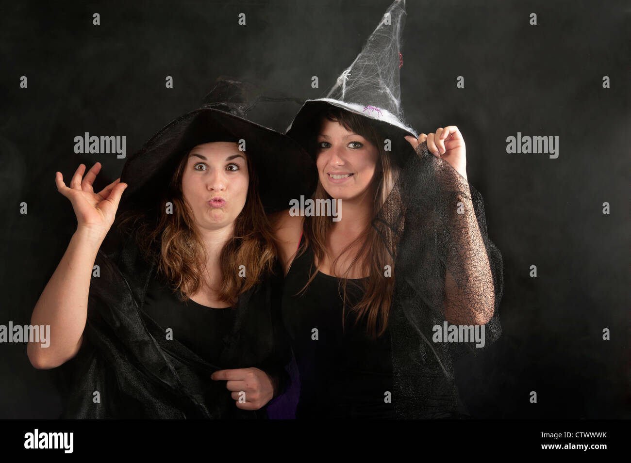 two halloween witches on dark background Stock Photo - Alamy