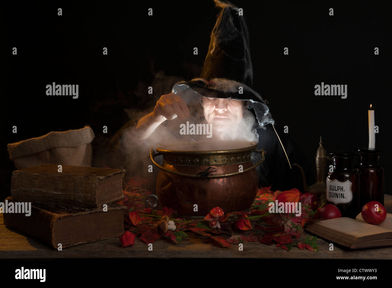 Witch in wizard cauldron hi-res stock photography and images - Alamy
