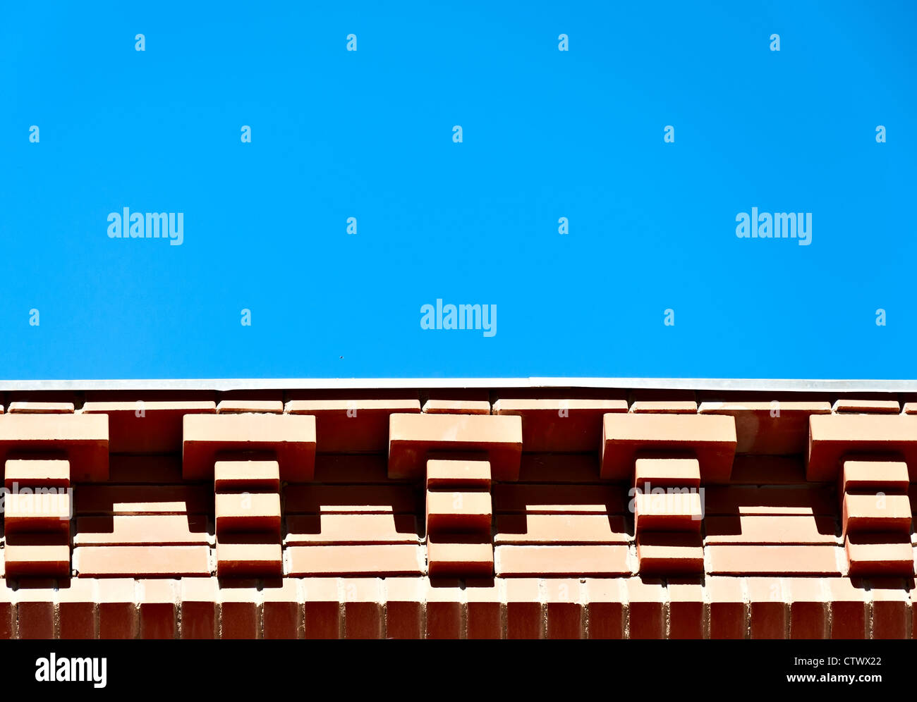 Architectural background - brick eaves against the blue sky Stock Photo ...