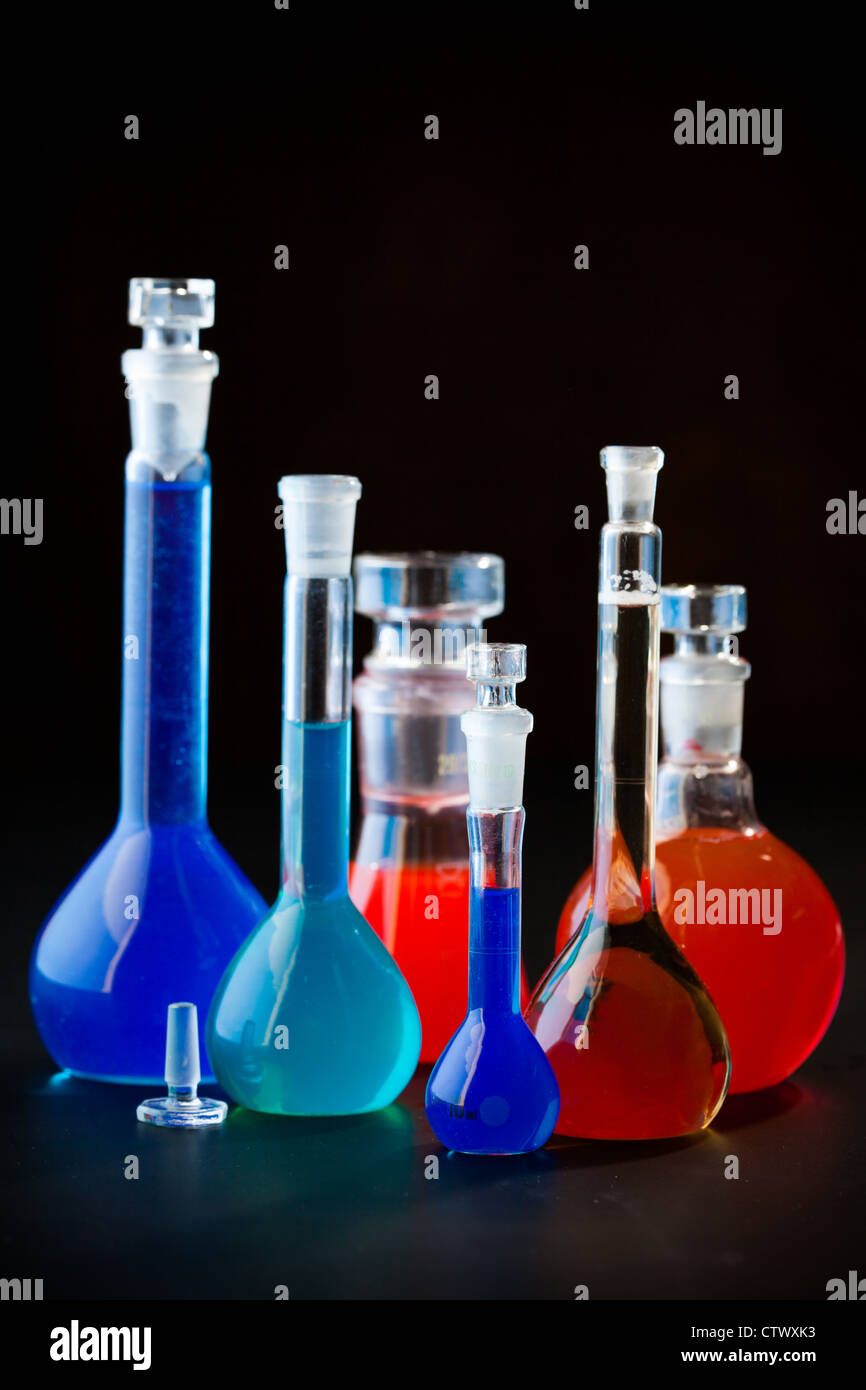 Lab flask on black background Stock Photo - Alamy