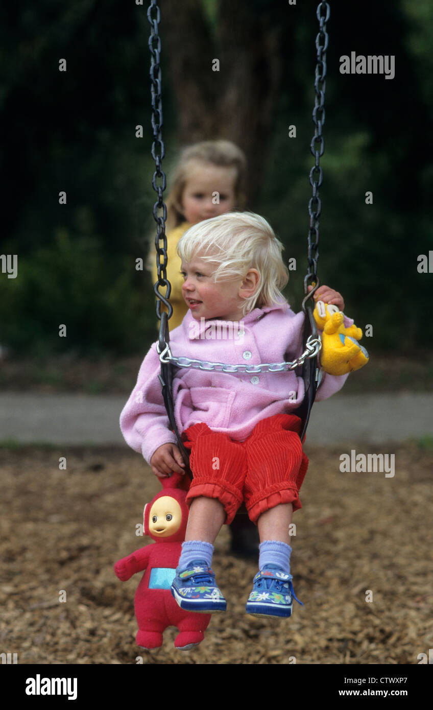 Child pushed on swing hi-res stock photography and images - Alamy