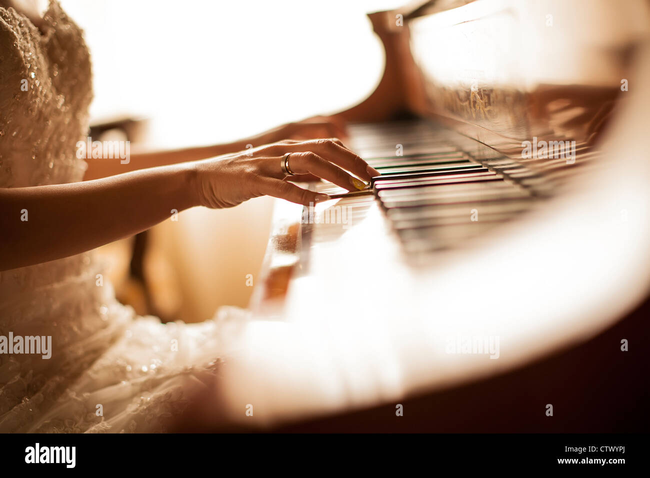 Beautiful girl playing grand piano hi-res stock photography and images ...