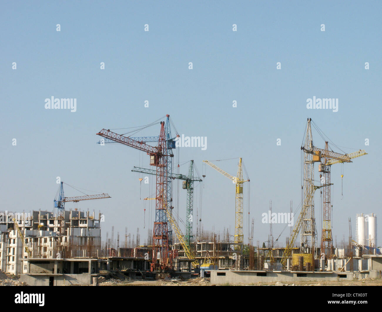 building cranes on a construction yard Stock Photo - Alamy