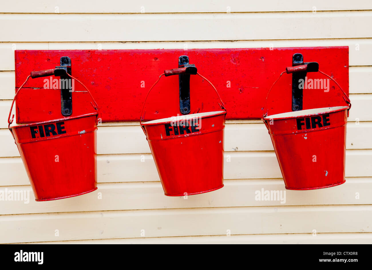 Red fire buckets at vintage railway station, Wales, UK Stock Photo - Alamy