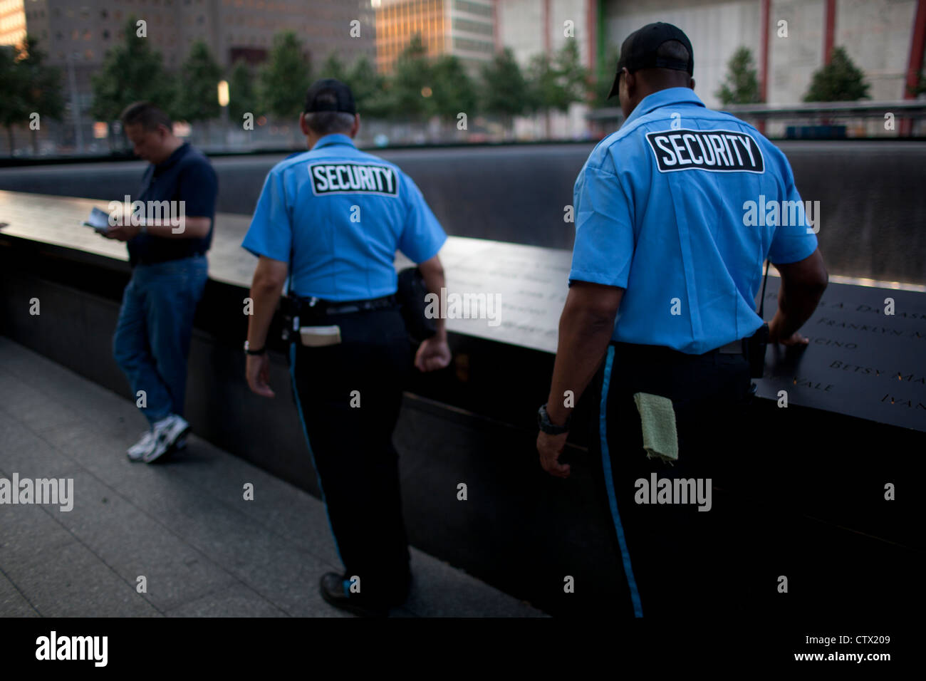 Security guards check for vandalism along the 9-11 Memorial pool at the ...