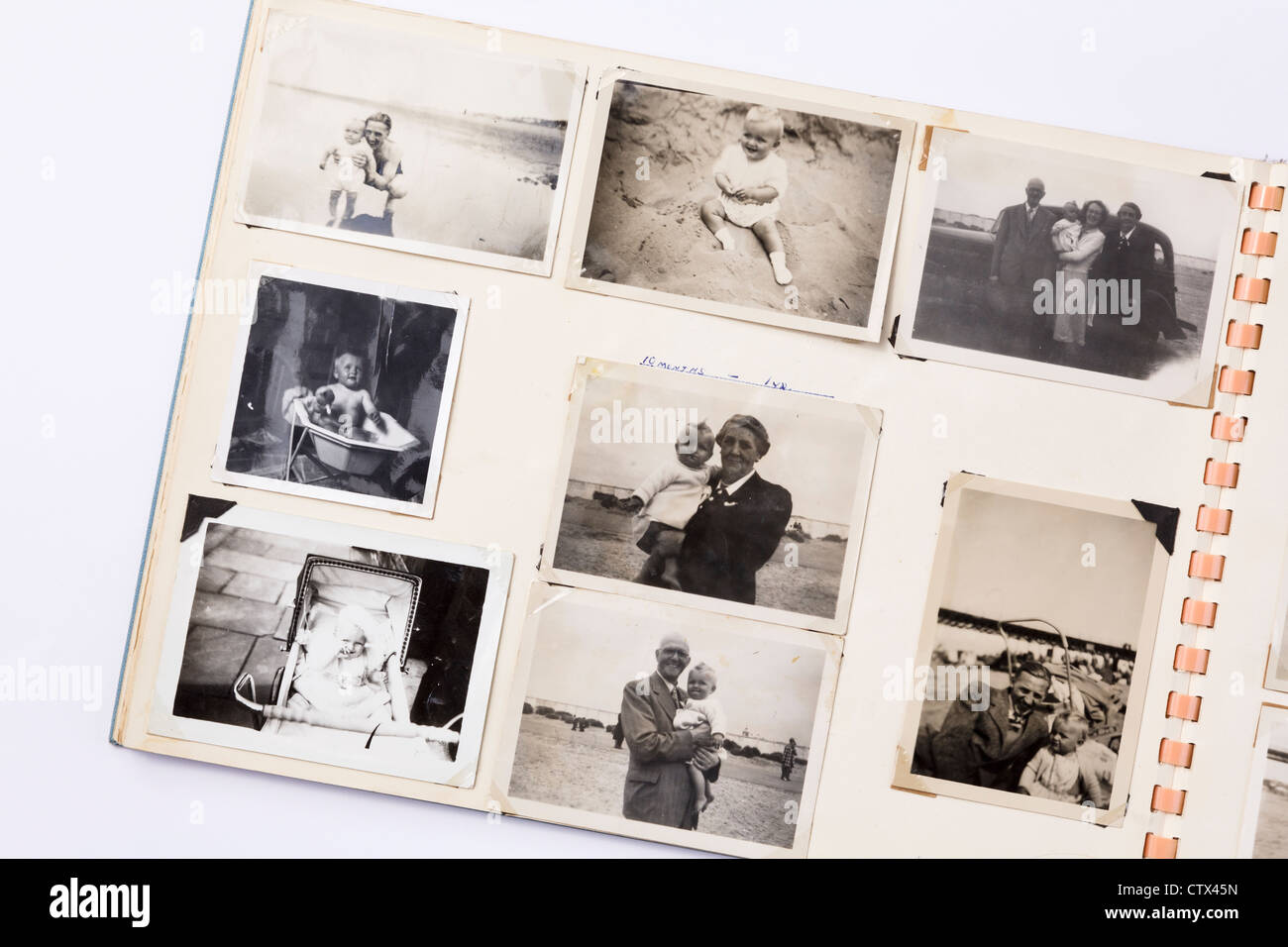 Old faded black and white printed photographs in a family photograph ...