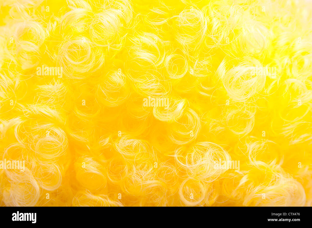 yellow artificial hair background Stock Photo - Alamy