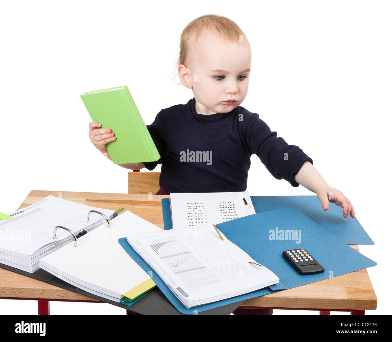 young child working at writing desk in light background Stock Photo - Alamy