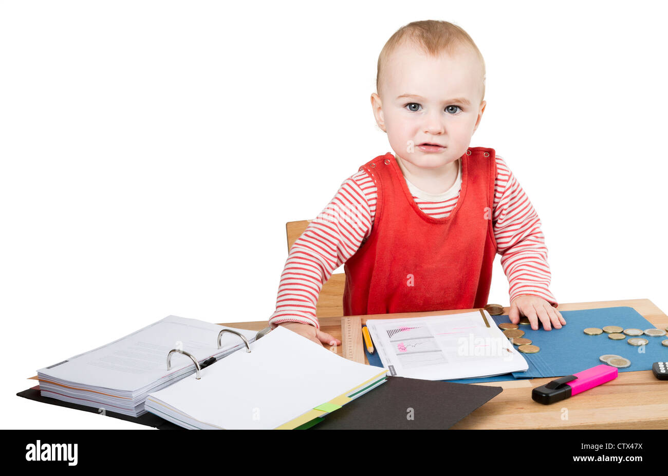 young child working at writing desk in light background Stock Photo - Alamy