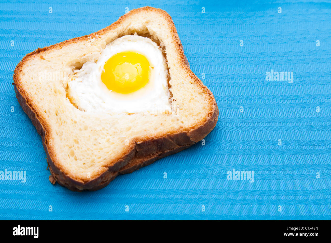 Heart toast on blue background Stock Photo - Alamy