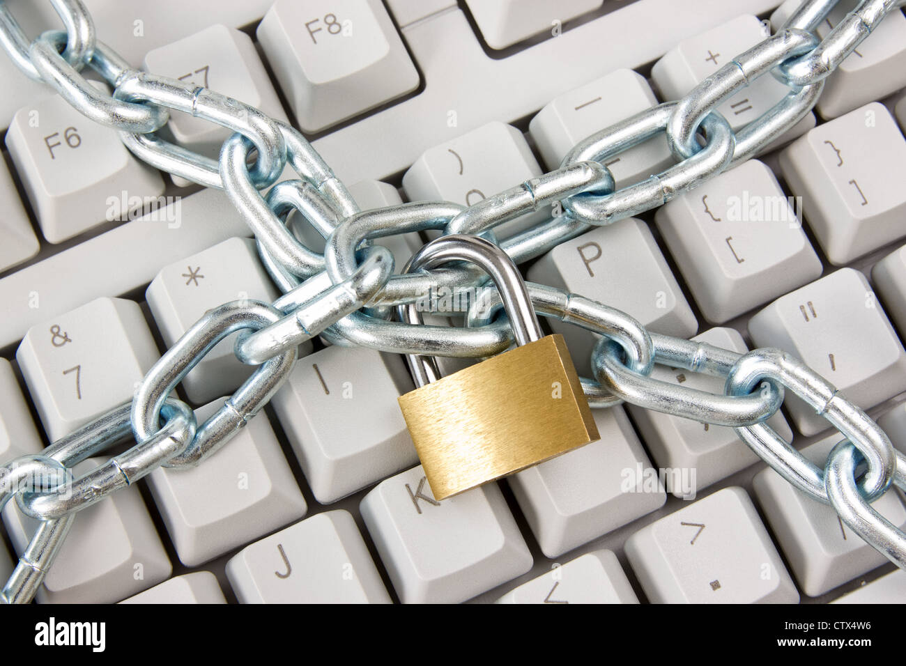 computer keyboard secured with chain and padlock Stock Photo - Alamy