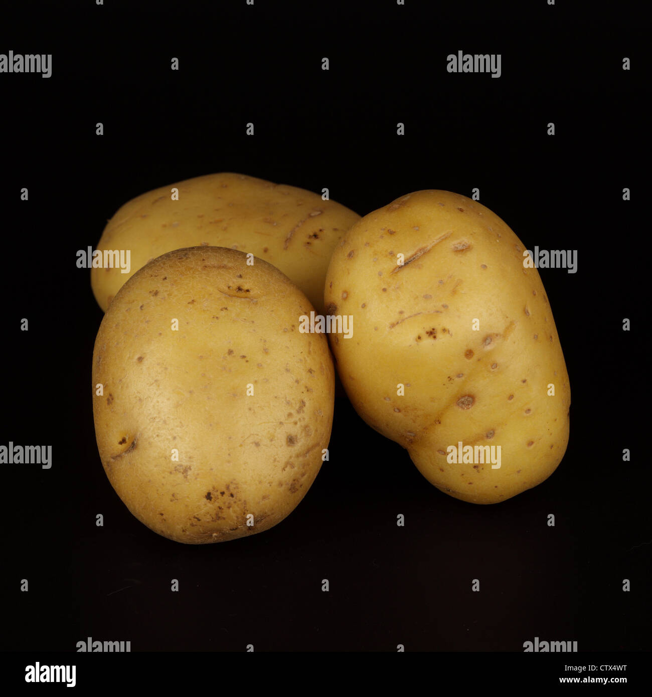 Three whole fresh potatoes hi-res stock photography and images - Alamy