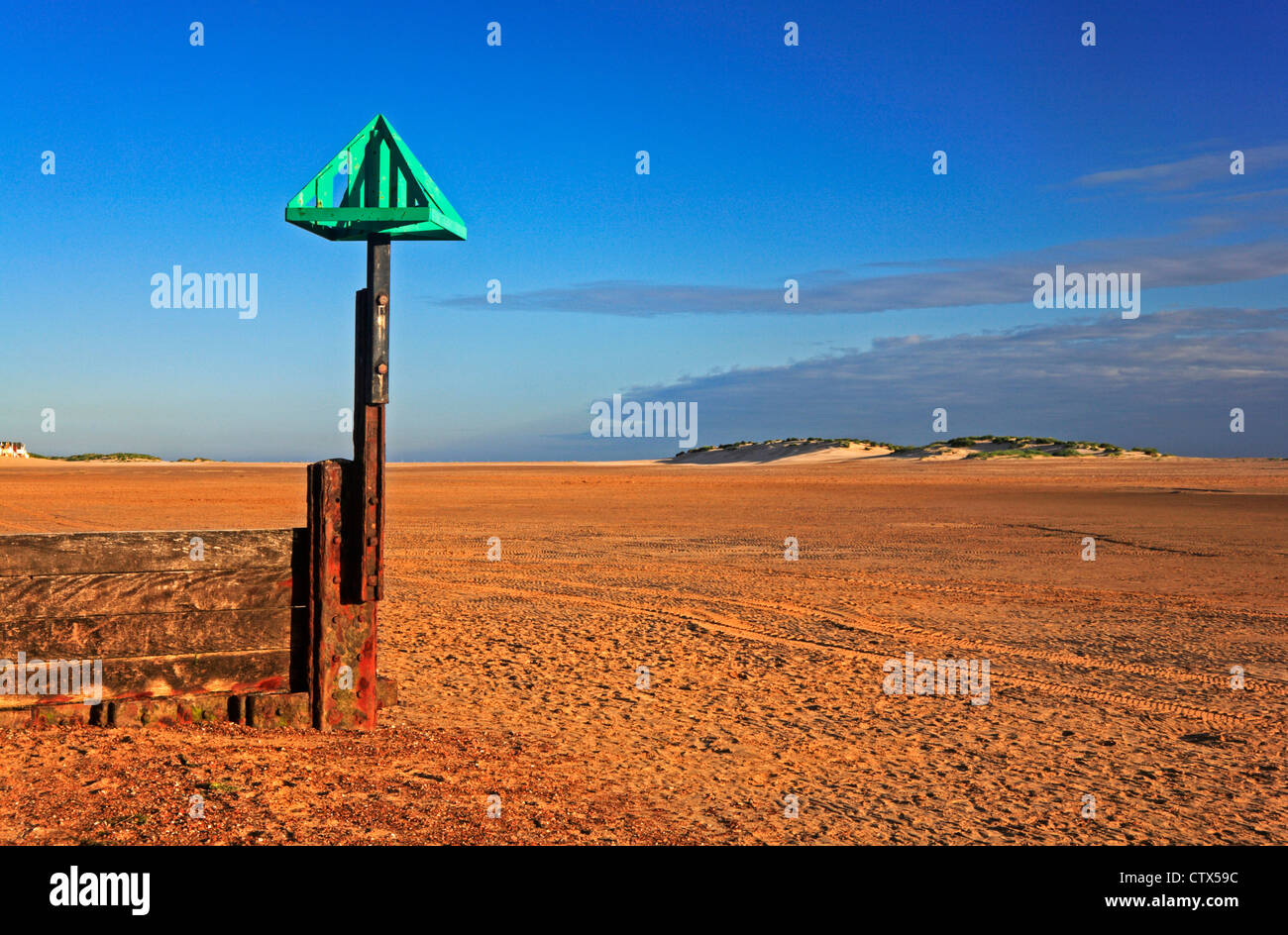 An early morning view of a groyne marker post at low tide at Wells-next ...