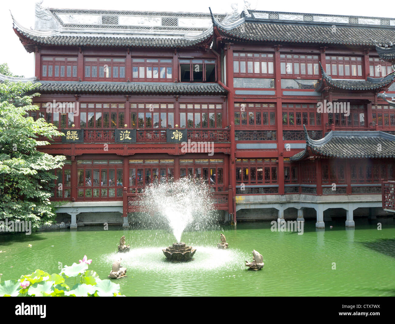 View of traditional looking Chinese buildings and fountain in the ...