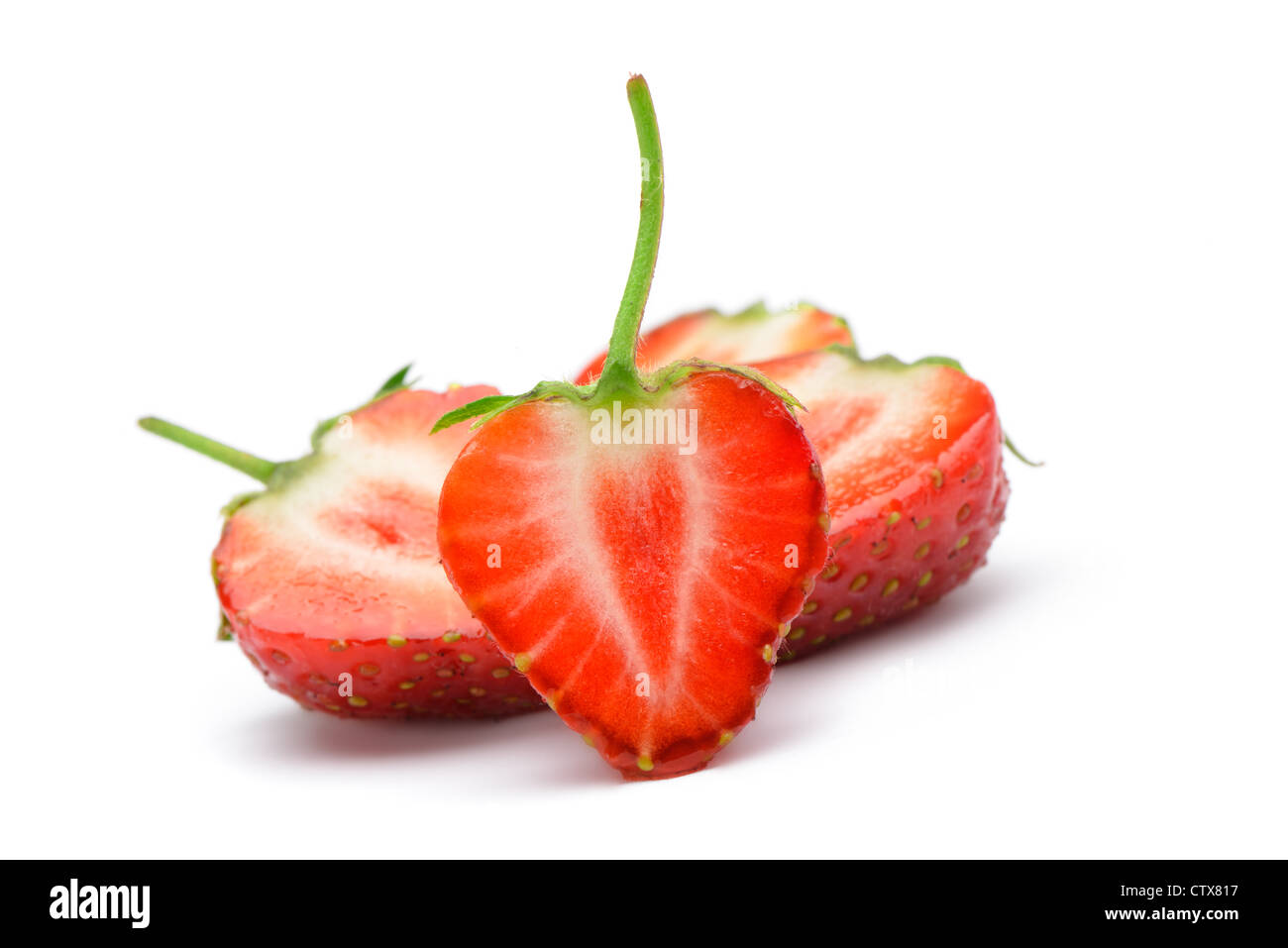 Section strawberries. Detailed cut strawberries isolated on white ...