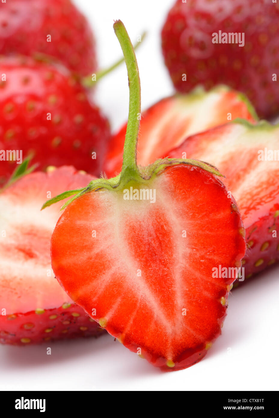 Section strawberries. Detailed cut strawberries isolated on white ...