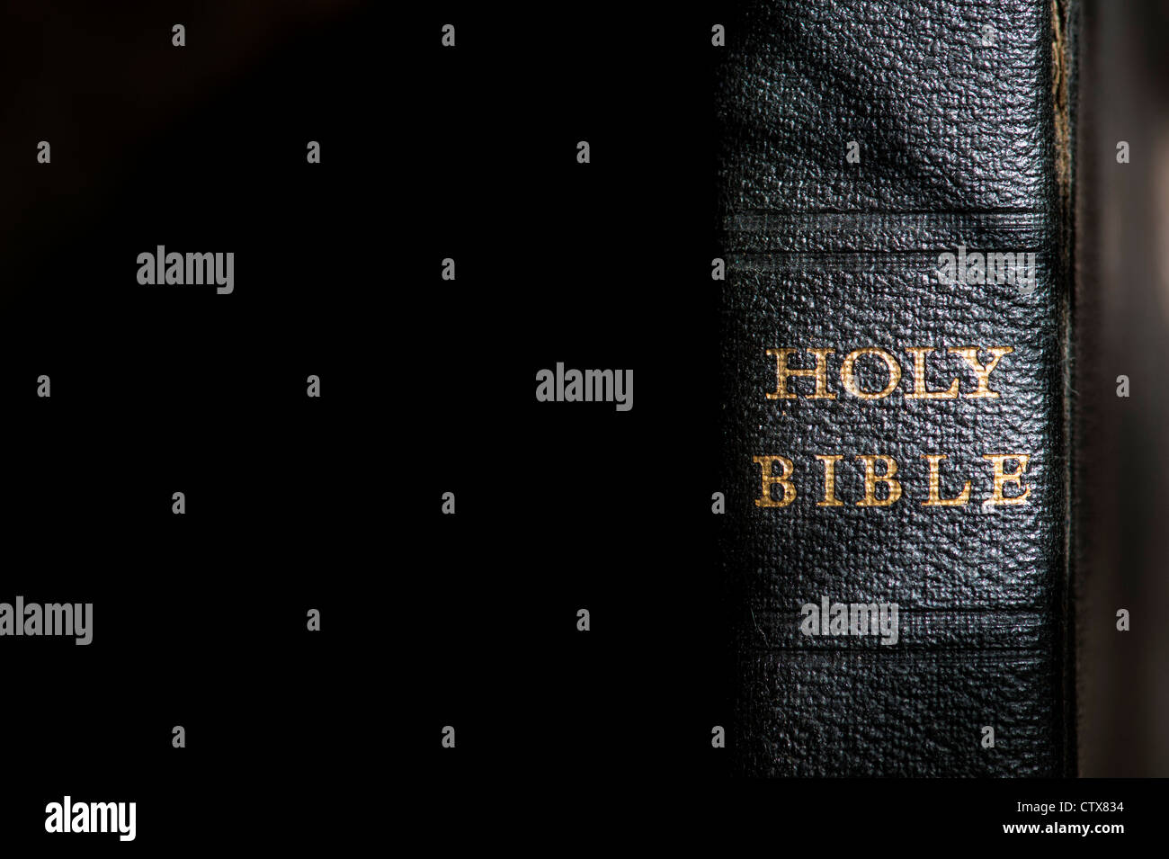 Holy Bible against a dark background Stock Photo - Alamy