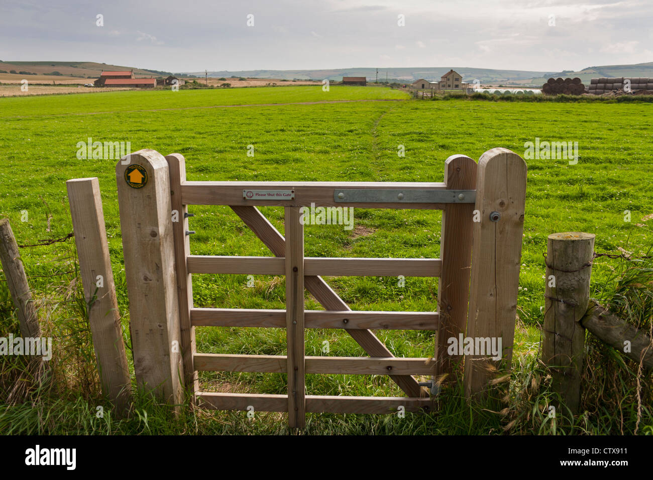 A gate on a footpath through a farmers field Stock Photo - Alamy