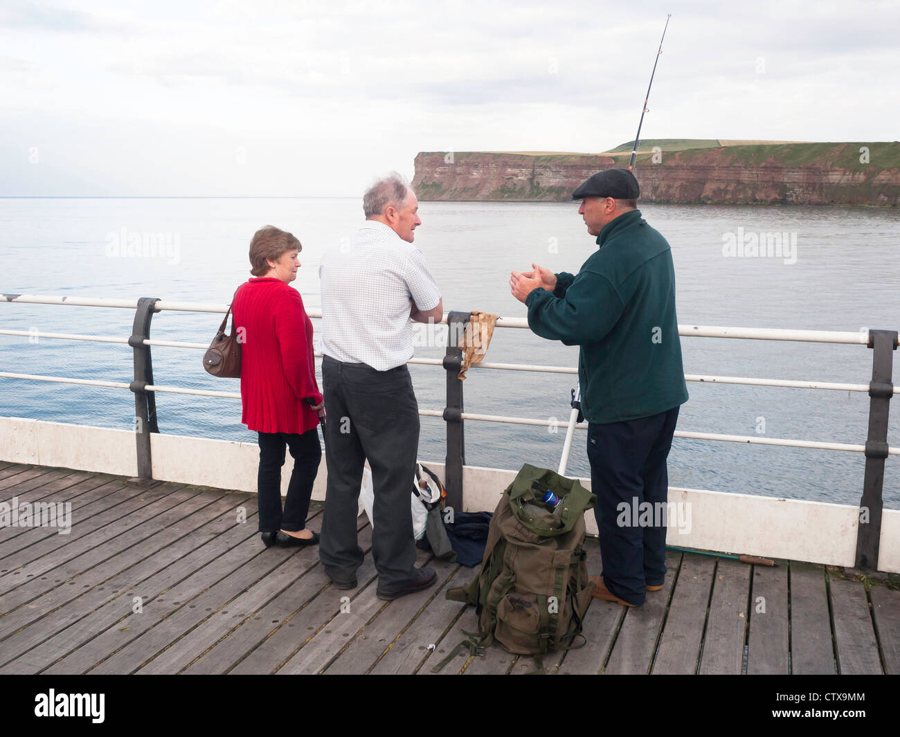 Couple fishing from pier hi-res stock photography and images - Alamy