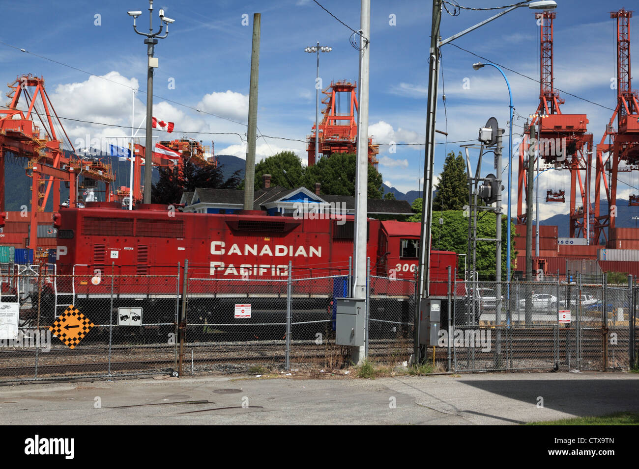 Cranes and train in the dock area of Vancouver Stock Photo - Alamy