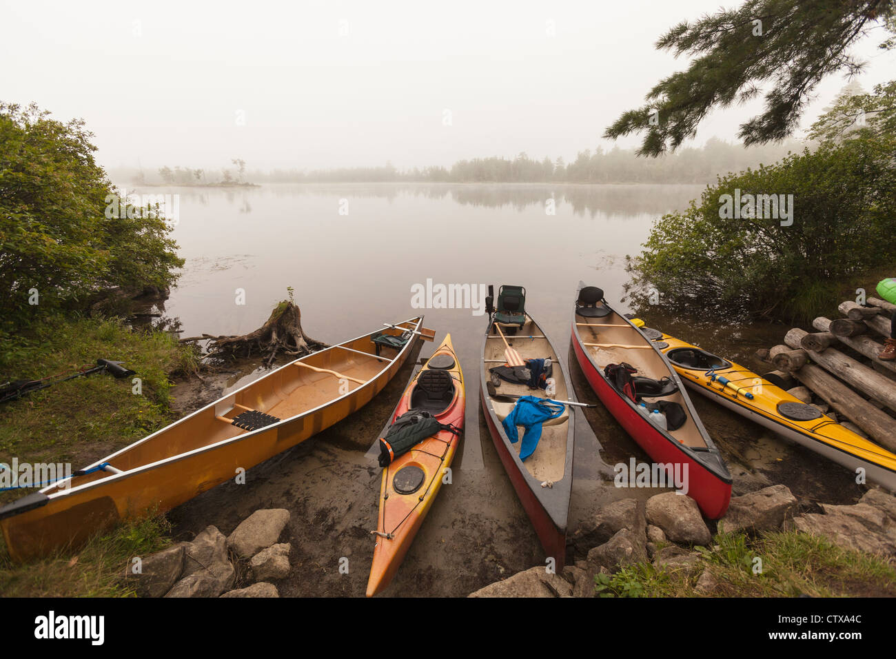 Canoes and kayaks at the lakeside, Lake Umbagog, New Hampshire, USA ...