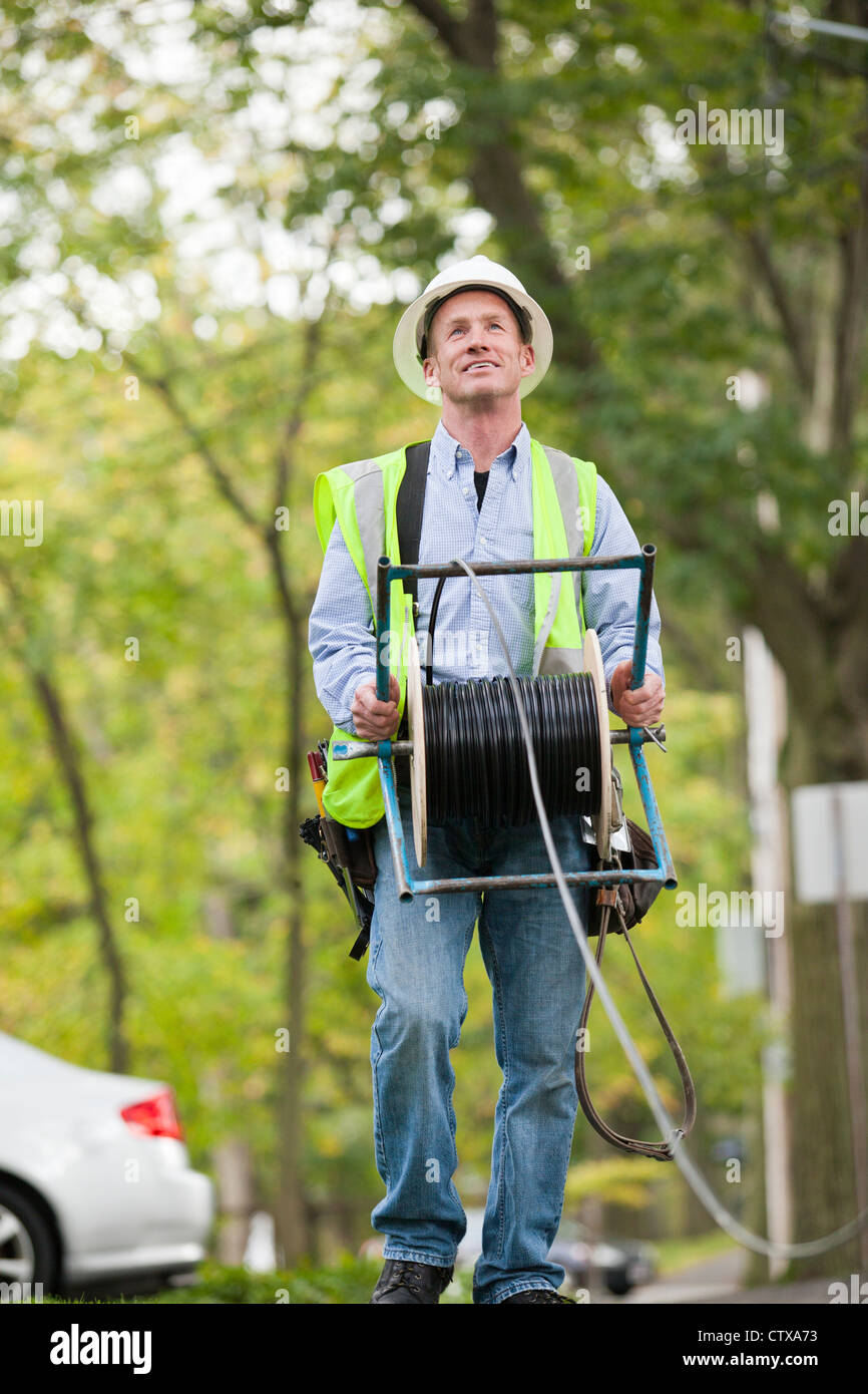 Electrician unwinding cable hi-res stock photography and images - Alamy