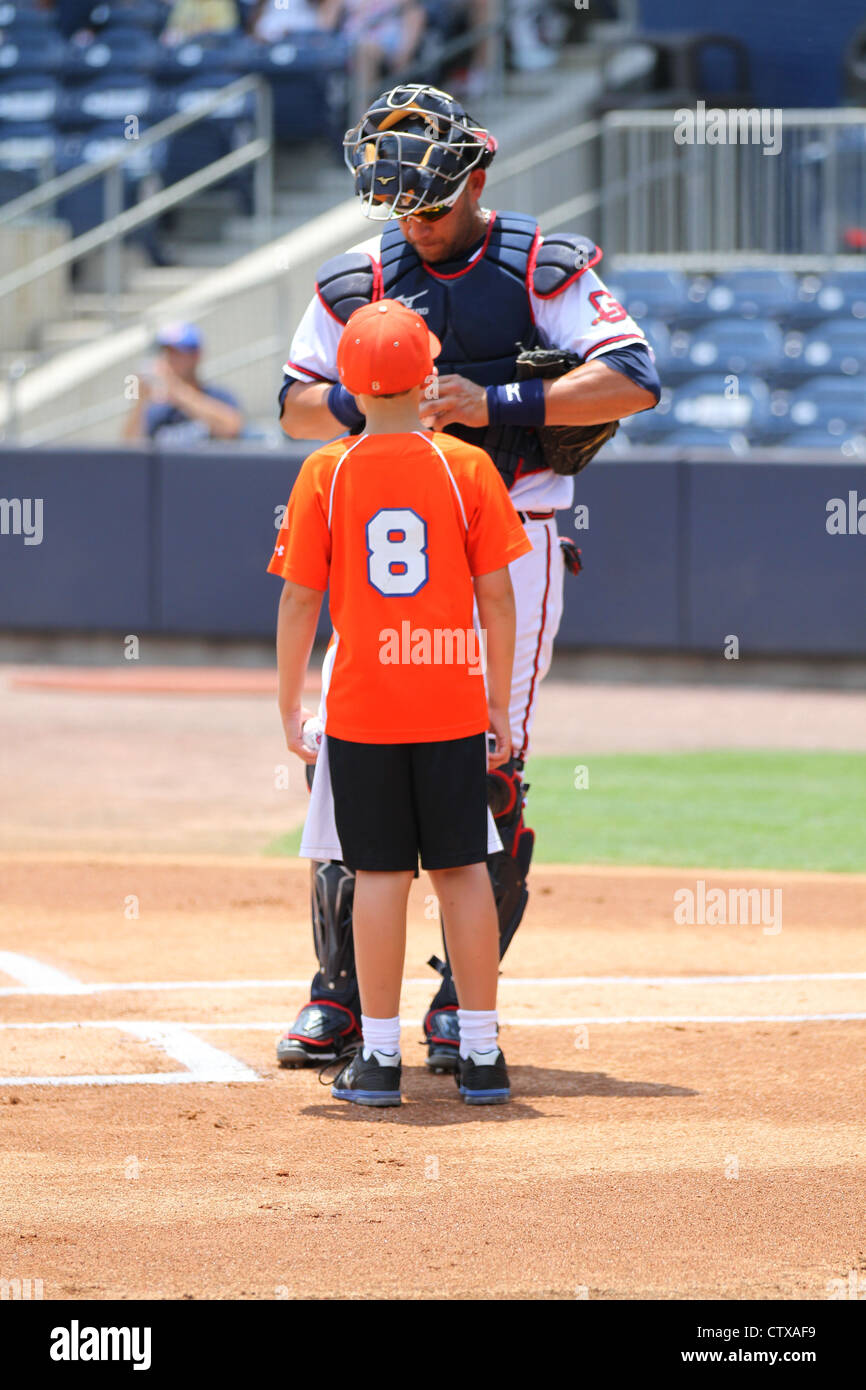 Young fan gets autograph from JC Boscan before a Gwinnett Braves Triple ...