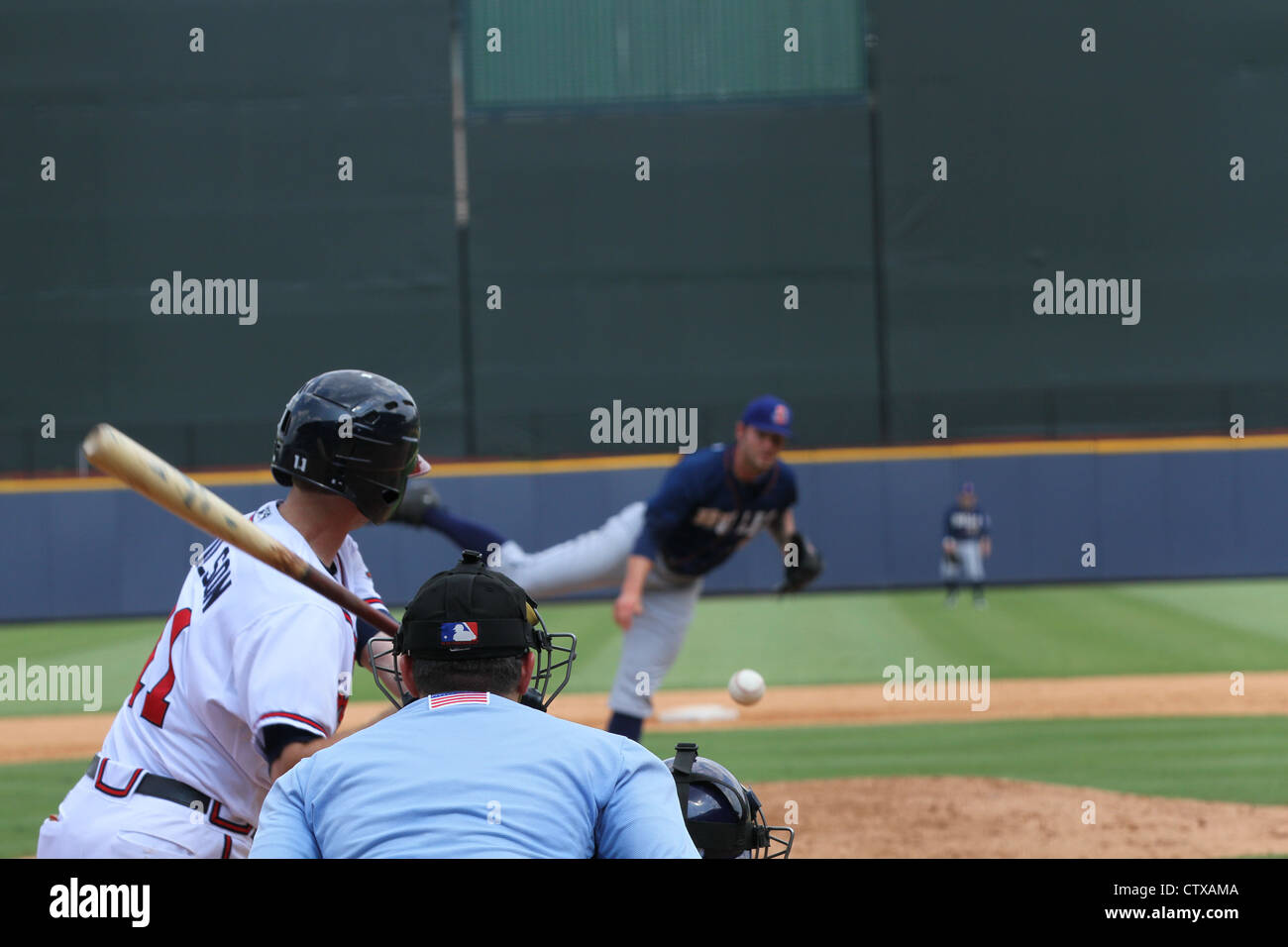 Umpire Gerard Ascani looks on as Durham Bulls pitcher Josh Lueke ...