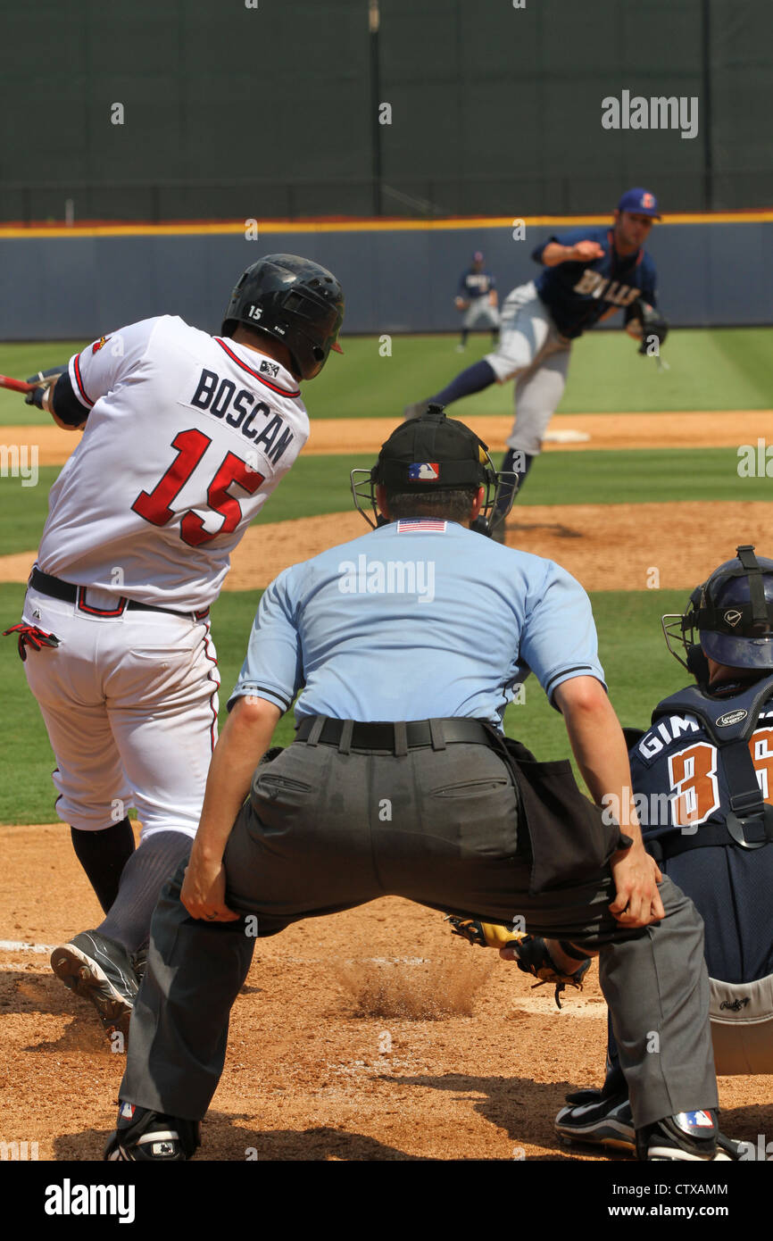 Umpire Gerard Ascani looks on as Durham Bulls pitcher Josh Lueke ...