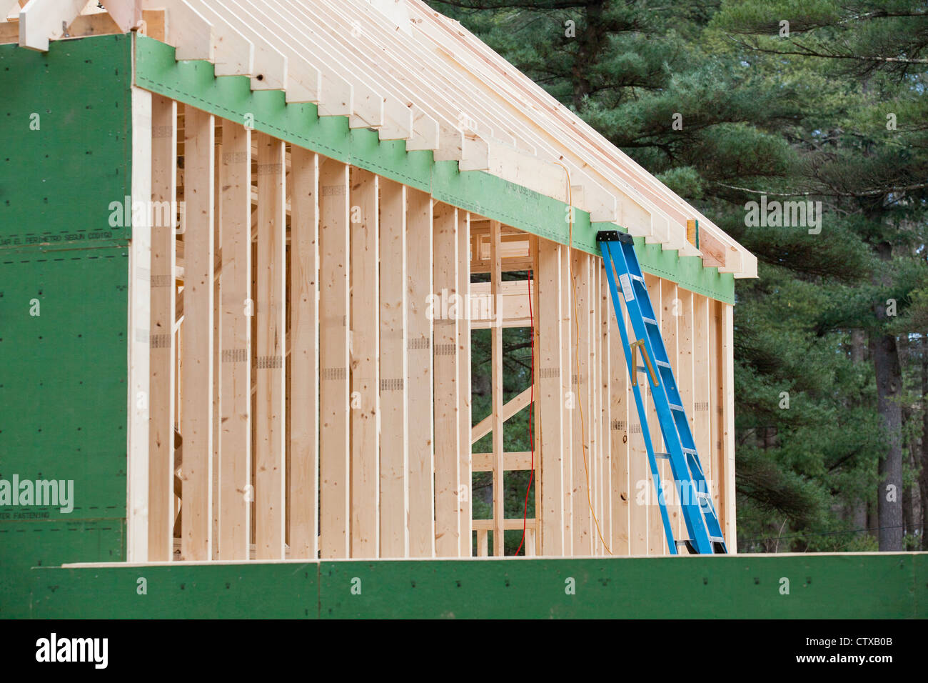 Ladder leaning against the wall frame of house under construction Stock ...