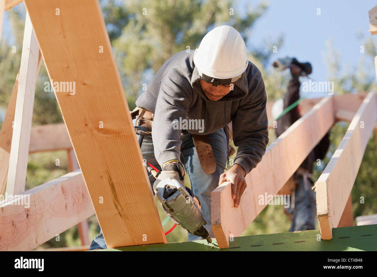 Effort looking down standing working holding hi-res stock photography ...