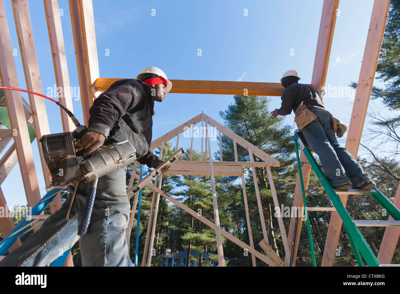 Carpenters bringing tools for installing beam Stock Photo - Alamy
