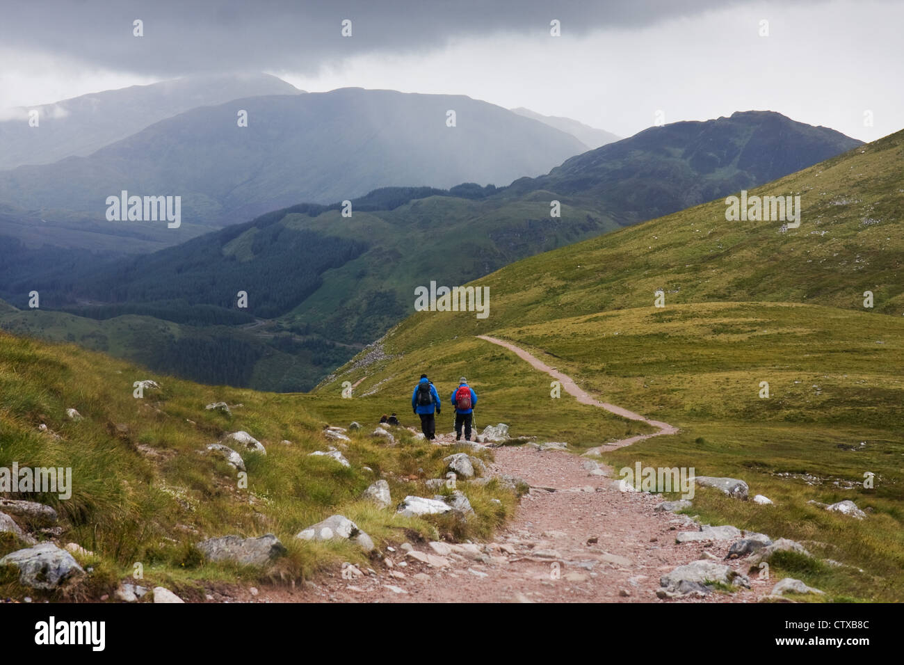 Walkers descend the Ben Nevis tourist path near Lochan Meall an t ...