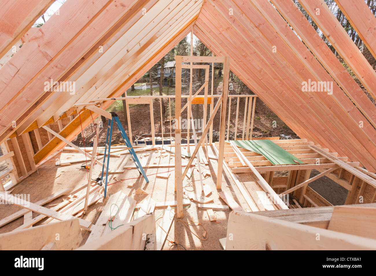 Interior view of roof rafters of a framed house Stock Photo - Alamy