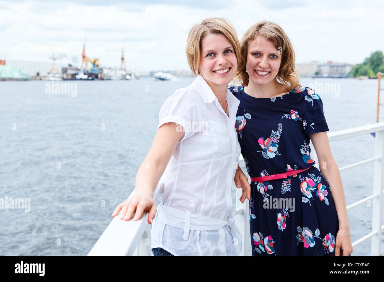 Two ladies on ship deck together with copyspace Stock Photo - Alamy