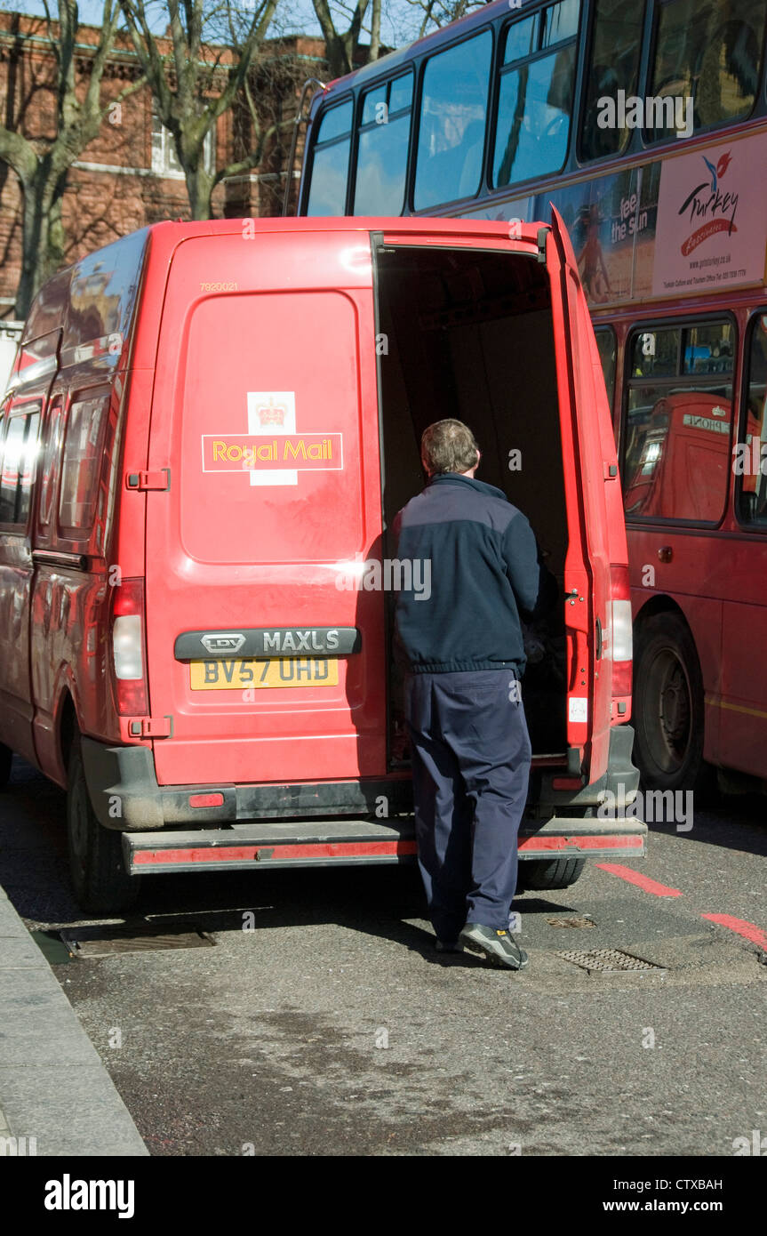 Delivery royal mail van from rear with doors open driver hi-res stock ...