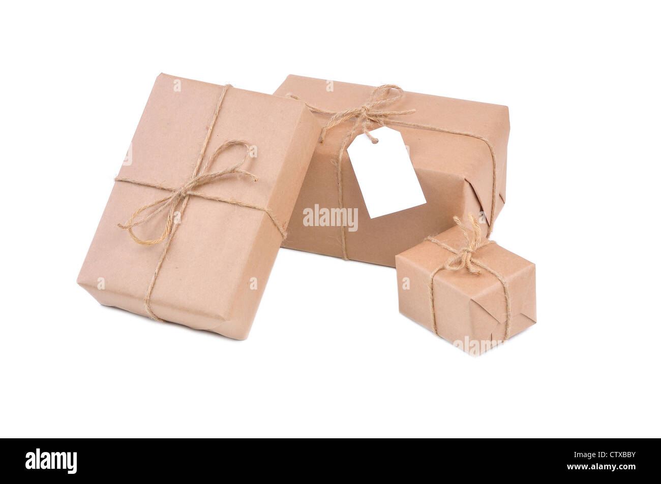 Three brown packages isolated on white Stock Photo - Alamy