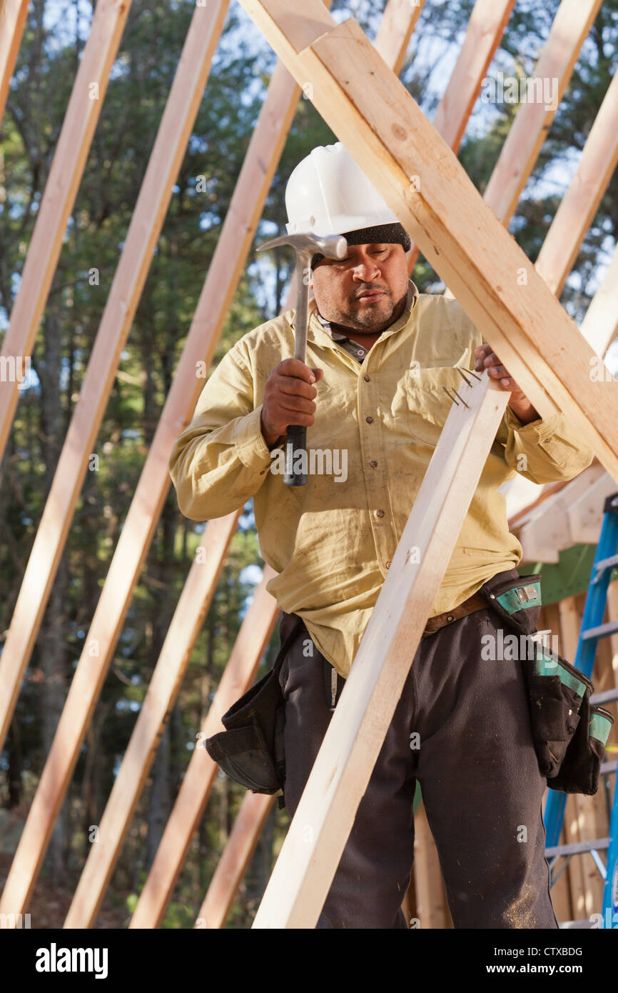 Carpenter removing nails from stud Stock Photo - Alamy