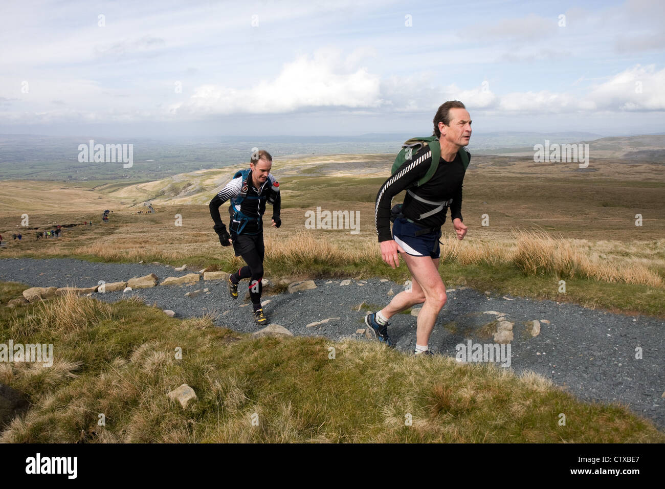 Competitors in the Fellsman tackle the path up Ingleborough Stock Photo ...