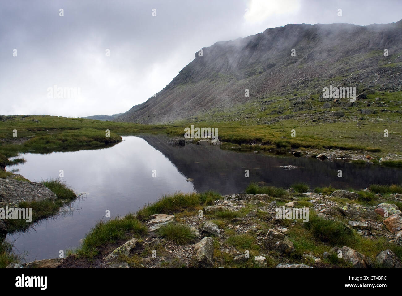 Three Tarns, with Bowfell Links in the distance Stock Photo - Alamy