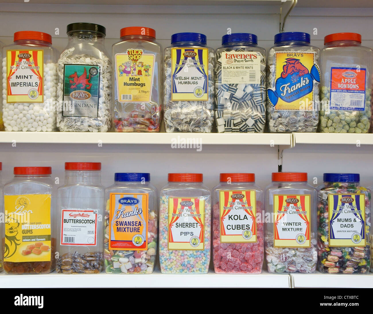 Jars of Traditional Sweets on a shelf in a market stall in Carmarthen ...