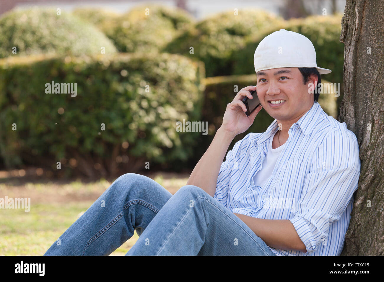 Chinese student talking on a cell phone Stock Photo - Alamy