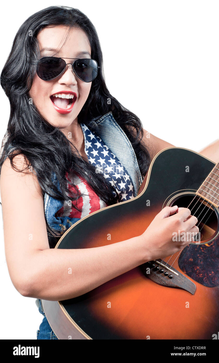 Girl,play the guitar,laughing Stock Photo - Alamy