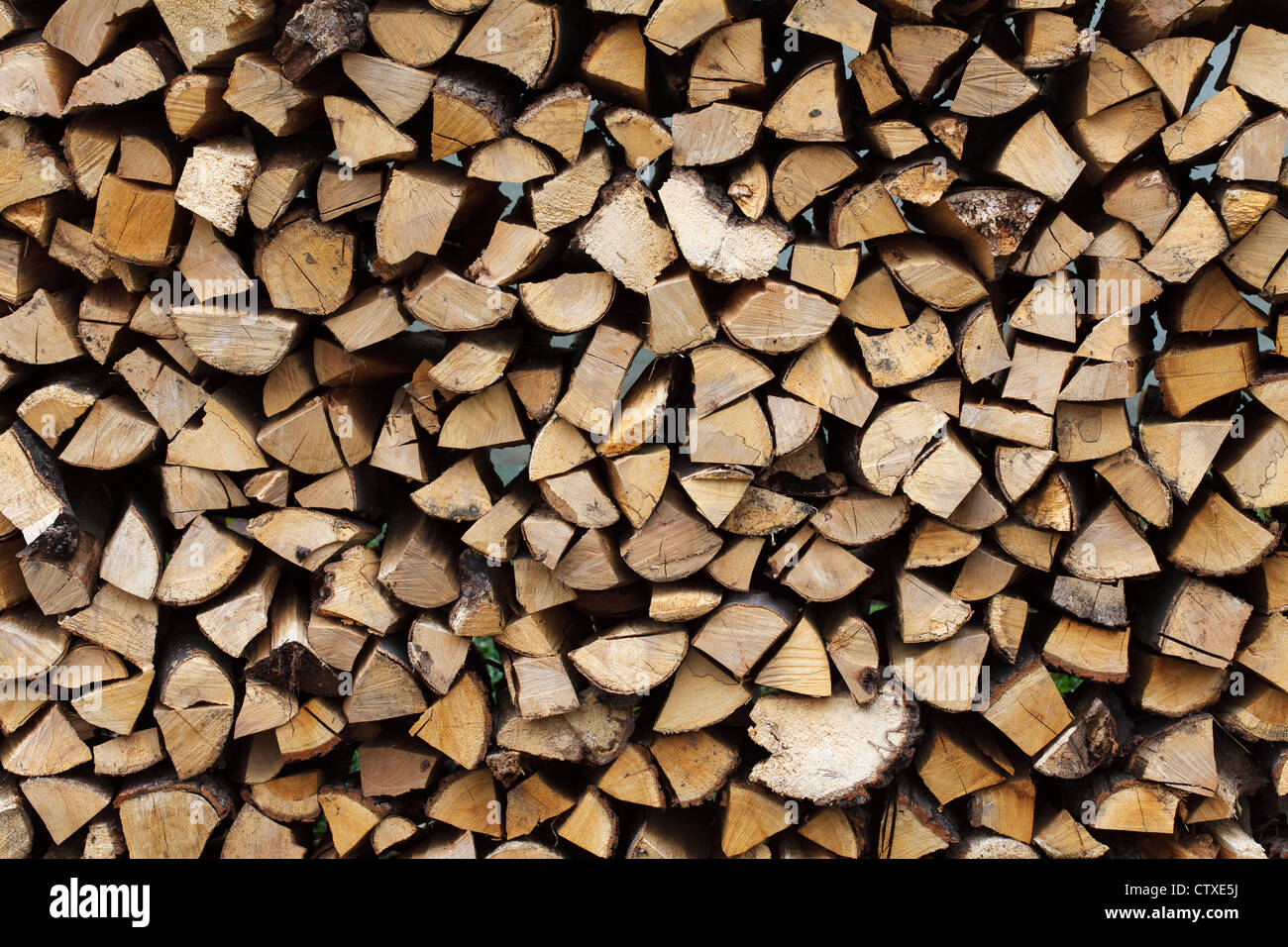 Stacked chopped wood for the winter or construction Stock Photo - Alamy