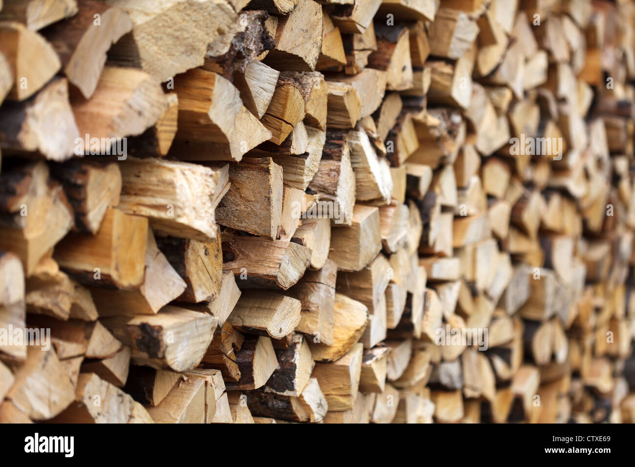 Stacked chopped wood for the winter or construction Stock Photo - Alamy