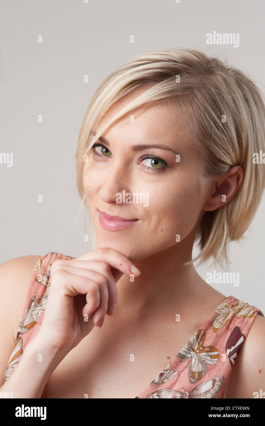 Blond woman with facial expression Stock Photo - Alamy