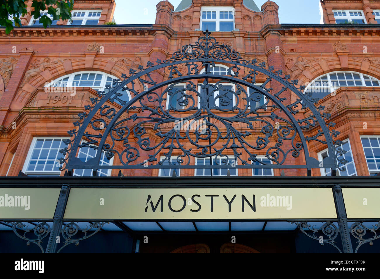 Oriel Mostyn Art Gallery modern & older signs above entrance with red ...