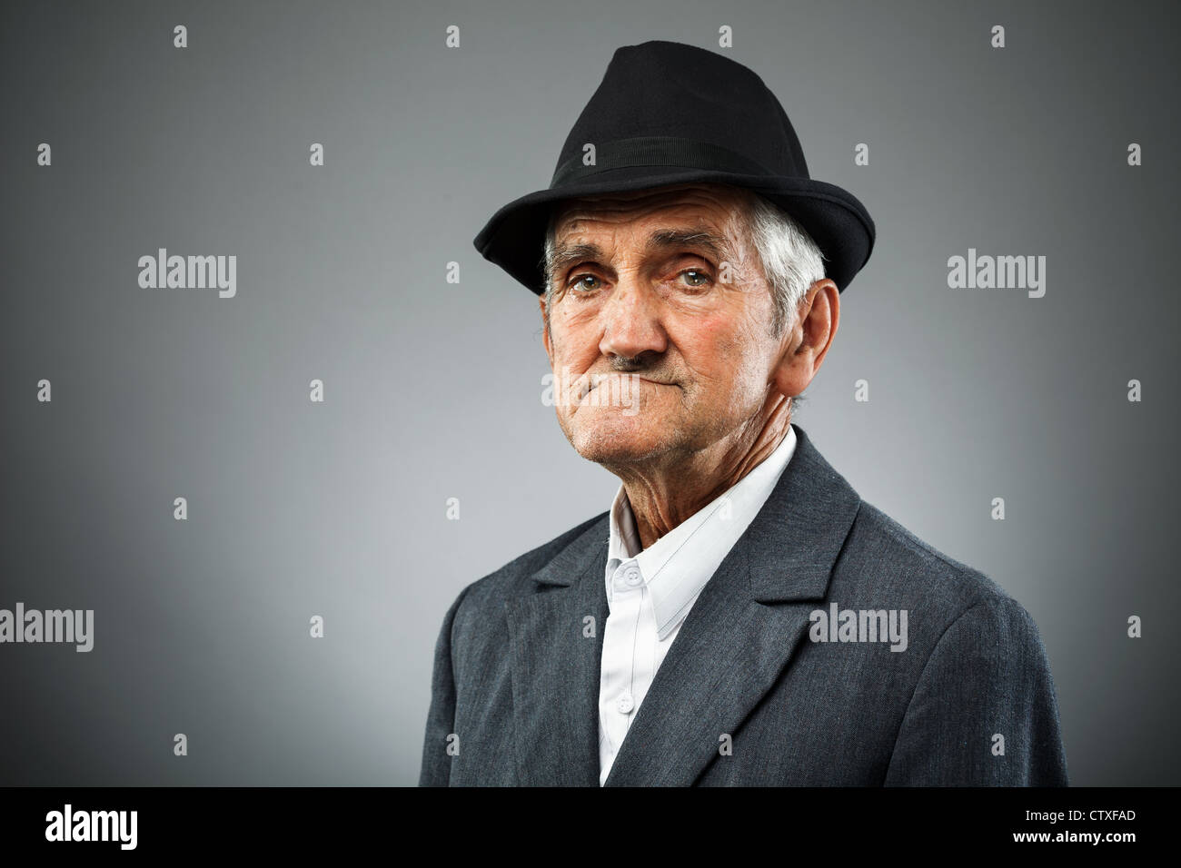 Studio portrait of an expressive old man Stock Photo - Alamy