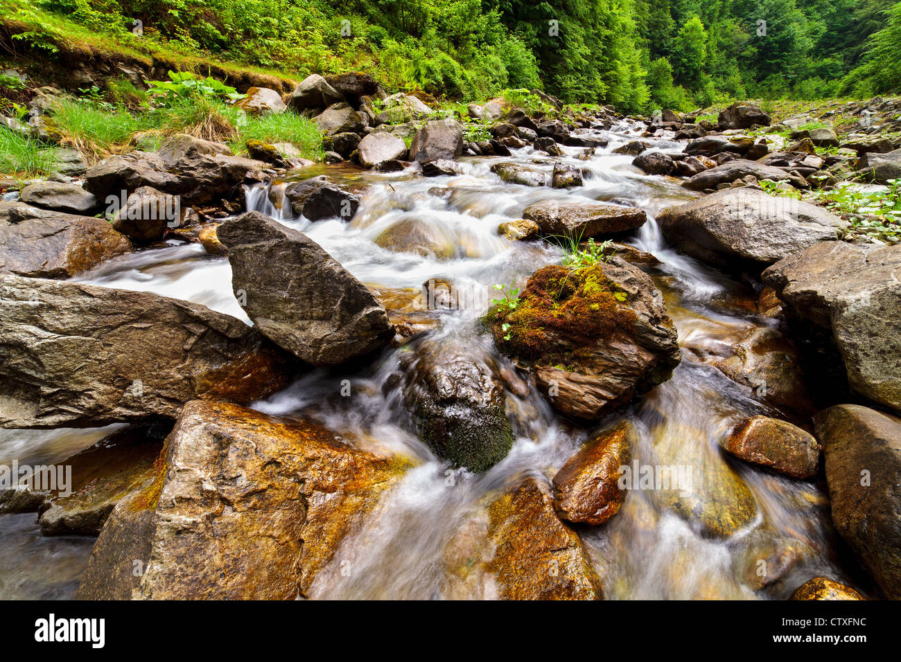 Landscape with river flowing through rocks Stock Photo - Alamy