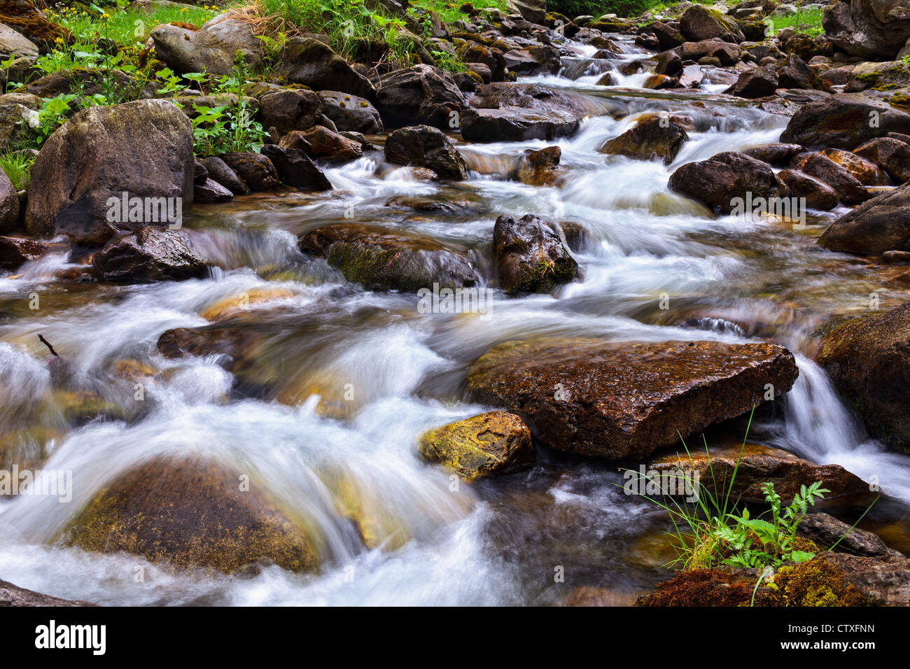 Landscape with river flowing through rocks Stock Photo - Alamy